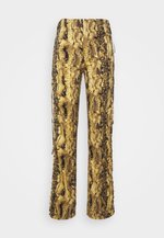 Materiel PYTHON PANTS - Pantalones - yellow/amarillo - Zalando.es