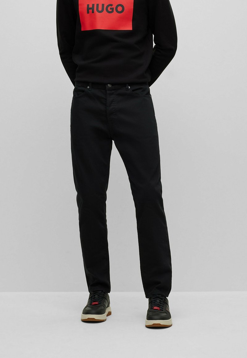 HUGO Jeans Tapered Fit - black - (Pre-owned) - Zalando
