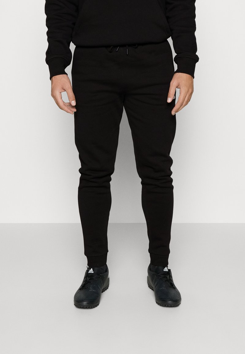 KLABU LOGO PANTS - Tracksuit bottoms - black - Zalando.ie
