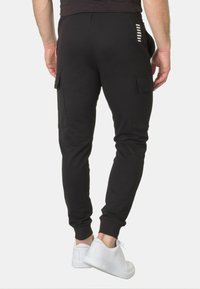 EA7 Emporio Armani Pantalon de survêtement - black/noir - ZALANDO.CH
