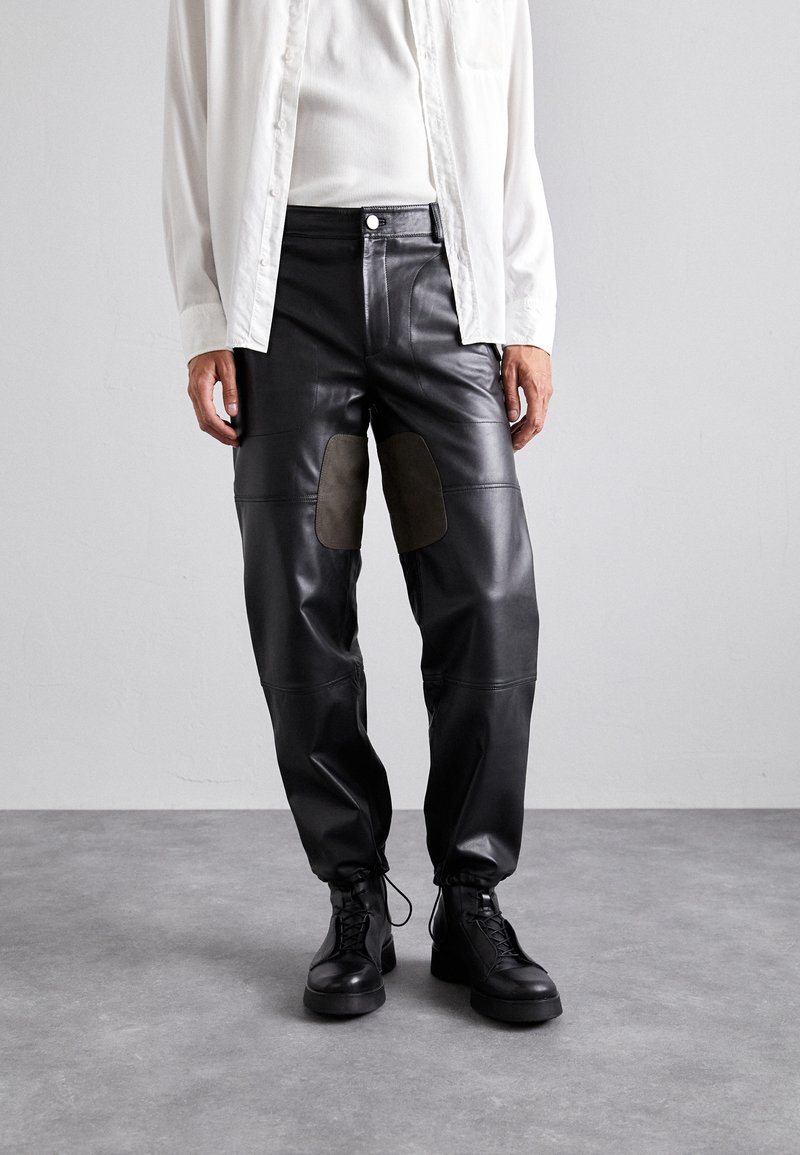 STUDIO ID PATCH TROUSERS - Leather trousers - black - Zalando.co.uk