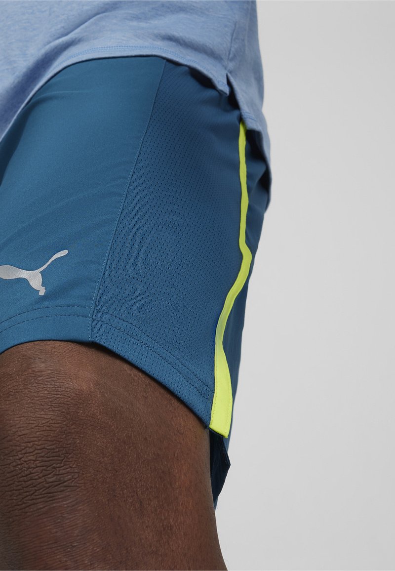 Puma RUN FAVORITE VELOCITY 7" - Sports shorts - ocean tropic/white ...