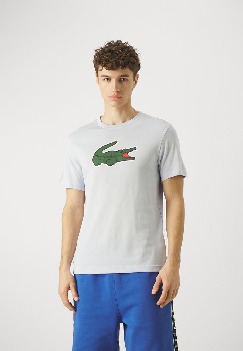 Lacoste Sport T-shirt print - phoenix blue/green-white/lichtblauw ...