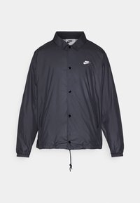 Nike Sportswear CLUB COACHES - Kevyt takki - black/white/musta - Zalando.fi