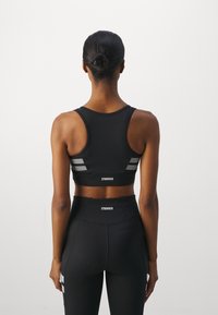 Stronger AMAZE - Sport-BH mit starker Stützkraft - black/schwarz ...