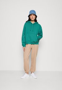 Weekday ESSENCE STANDARD HOODIE - Sweatshirt - green/grün - Zalando.de