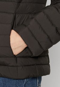 Calvin Klein PACKABLE SUPER PADDED JACKET - Daunenjacke - black/schwarz ...