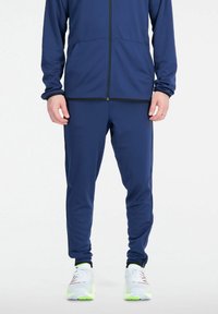 New Balance TENACITY - Tracksuit bottoms - nb navy/dark blue - Zalando ...