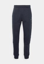 Champion TAPE CUFF PANTS - Tracksuit bottoms - darkblue/dark blue ...