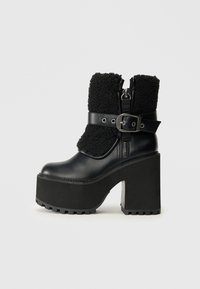 Buffalo KILLAH FOLD - Platform ankle boots - black - Zalando.ie