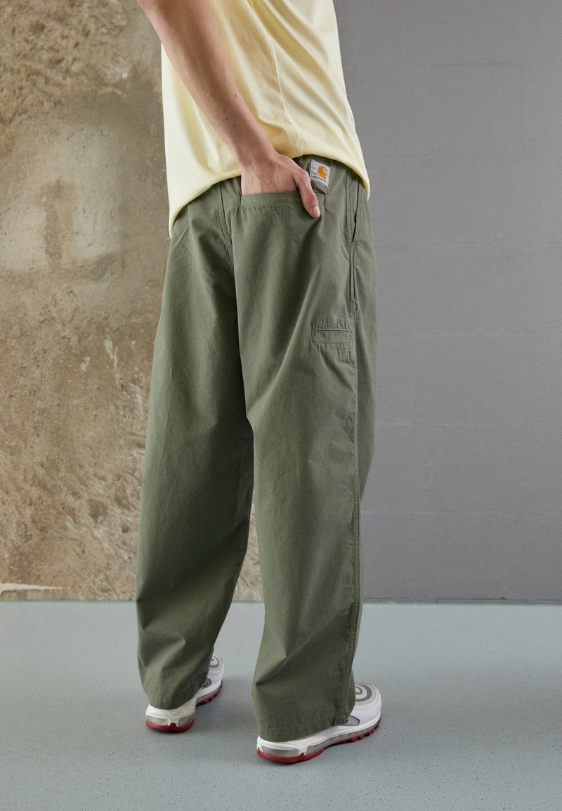 Carhartt WIP COLSTON PANT - Trousers - dollar green stone washed/green ...
