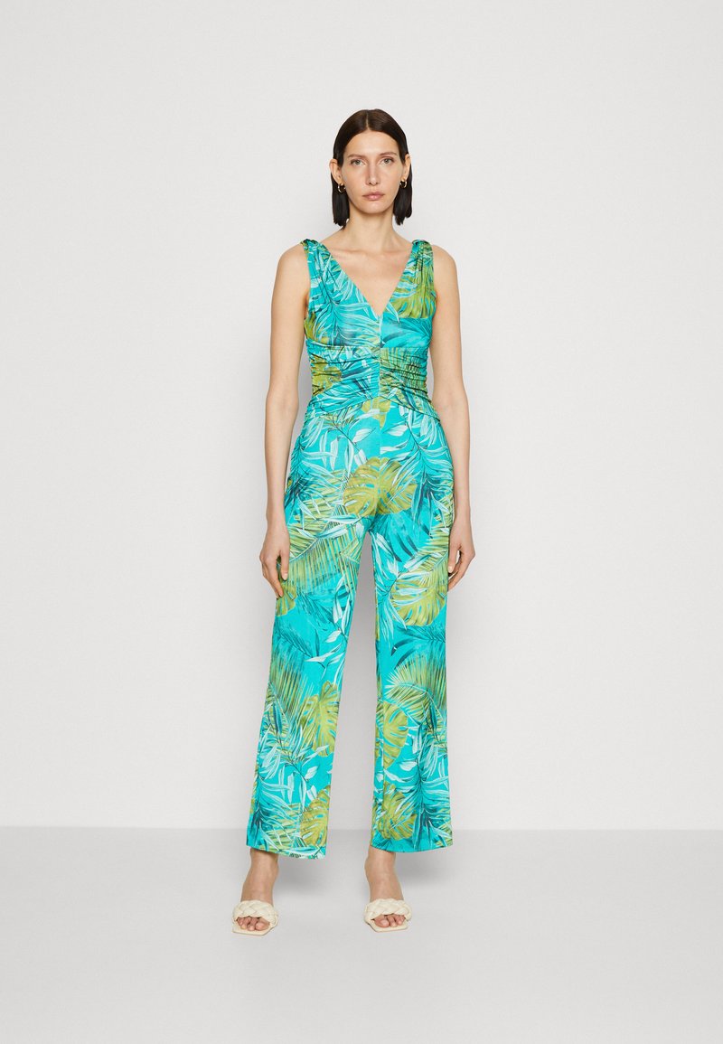 Guess SS COWL POPLIA OVERALL - Jumpsuit - hellblau/multi-coloured ...