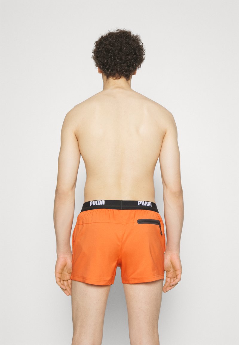 Puma SWIM MEN LOGO LENGTH SWIM SHORTS - Zwemshorts - chili powder ...
