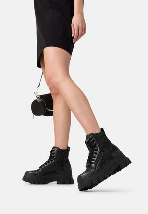 Buffalo VEGAN ASPHA MID - Stivaletti con plateau - black/nero - Zalando.it