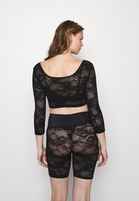 Triumph SMART DECO CROP - Unterhemd/-shirt - black/schwarz - Zalando.ch