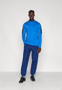 Nike Performance Pantalon de survêtement - blue void/game royal/white ...