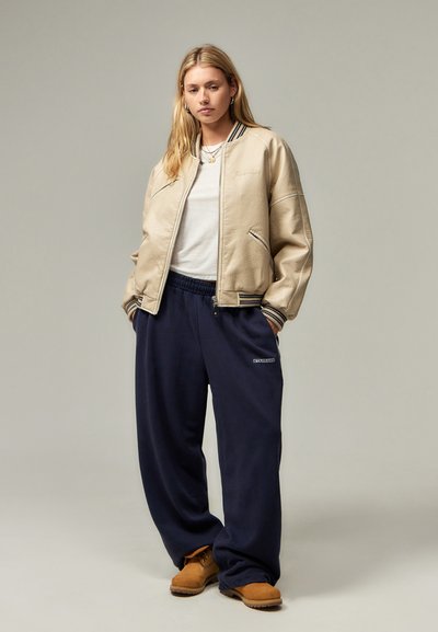 iets frans... HARRI WIDE LEG JOGGER UNISEX - Tracksuit bottoms - navy ...
