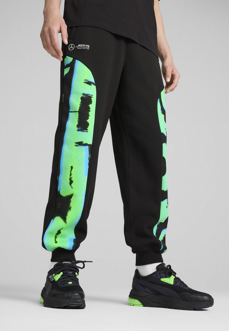 Puma NEON ENERGY - Spodnie treningowe/czarny - Zalando.pl