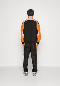 Night Addict Hardshelljacke - black/orange/schwarz - Zalando.de