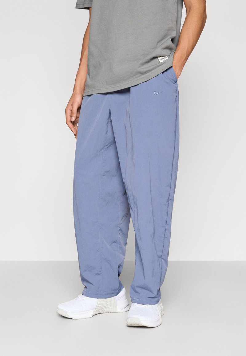 Nike Performance PANT - Verryttelyhousut - diffused blue/pale ivory ...