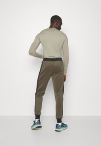 Venum UFC FIGHT WEEK MENS PERFORMANCE JOGGING PANTS - Tracksuit bottoms ...