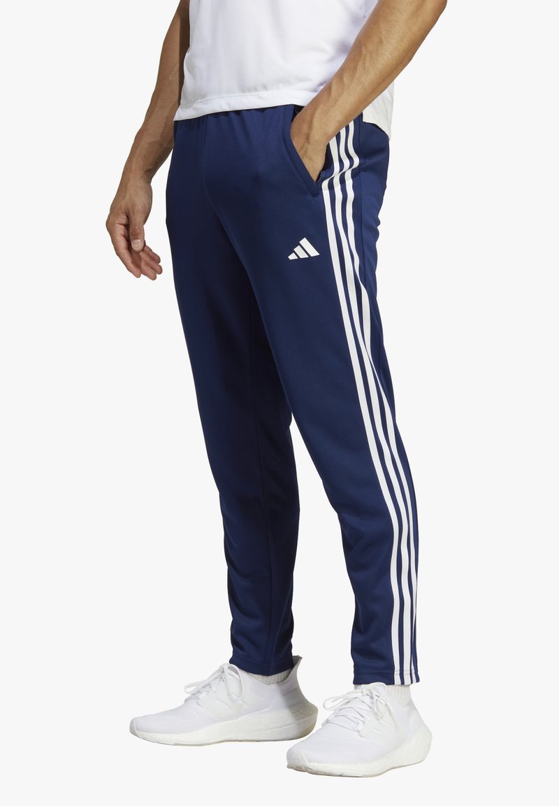 adidas Performance ESSENTIALS 3-STRIPES - Tracksuit bottoms - dark blue ...