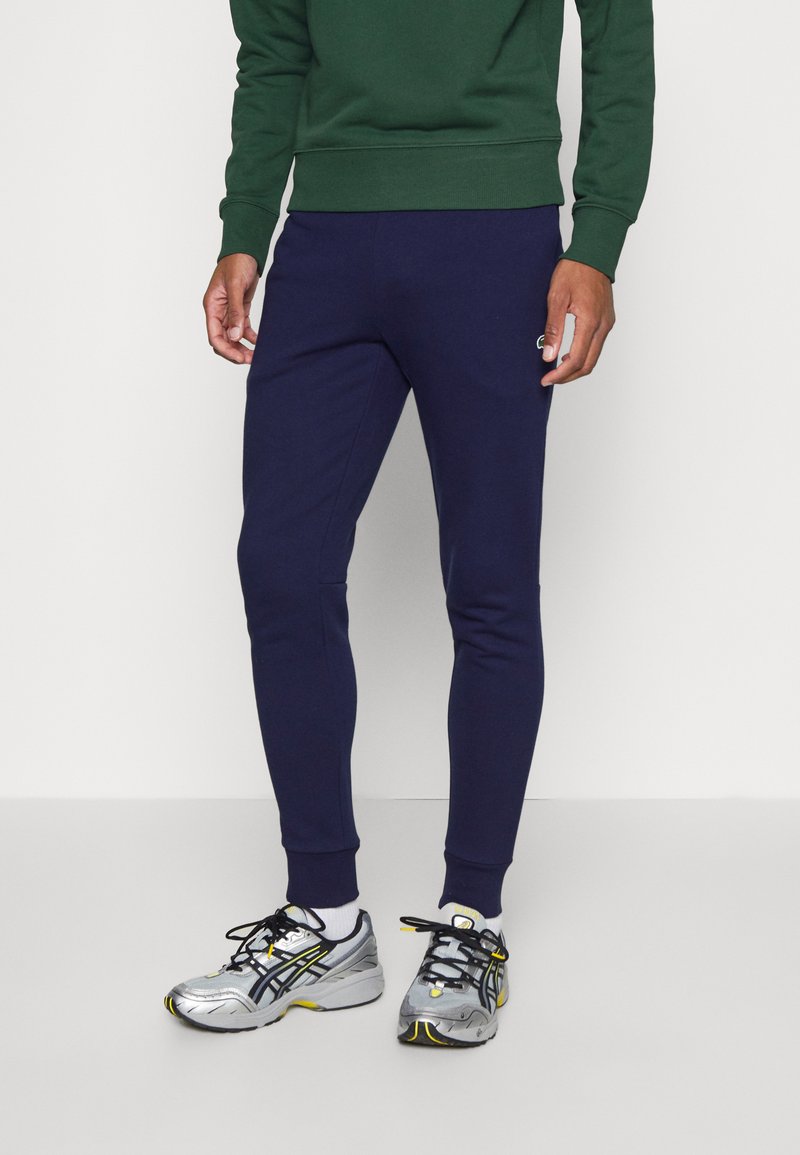 Lacoste UNISEX - Tracksuit bottoms - marine/dark blue - Zalando.co.uk