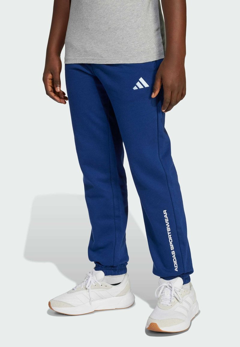 adidas Sportswear SLOGAN - Tracksuit bottoms - dark blue - Zalando.co.uk