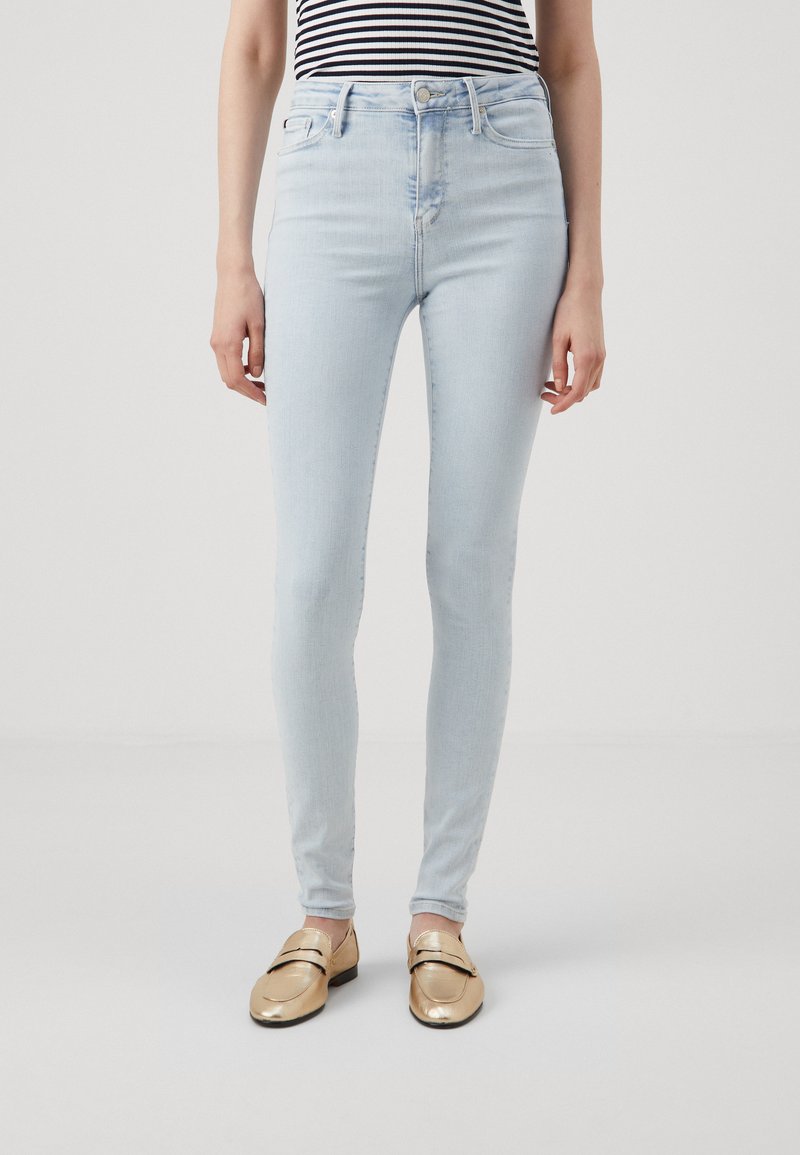 Tommy Hilfiger FLEX HARLEM - Jeans Skinny Fit - lola/light-blue denim ...