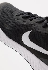 Nike Performance REVOLUTION 5 UNISEX - Road running shoes - black/white ...