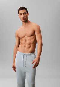Calvin Klein BLEND LOUNGE JOGGERS - Pyjama bottoms - cloud blue/light ...