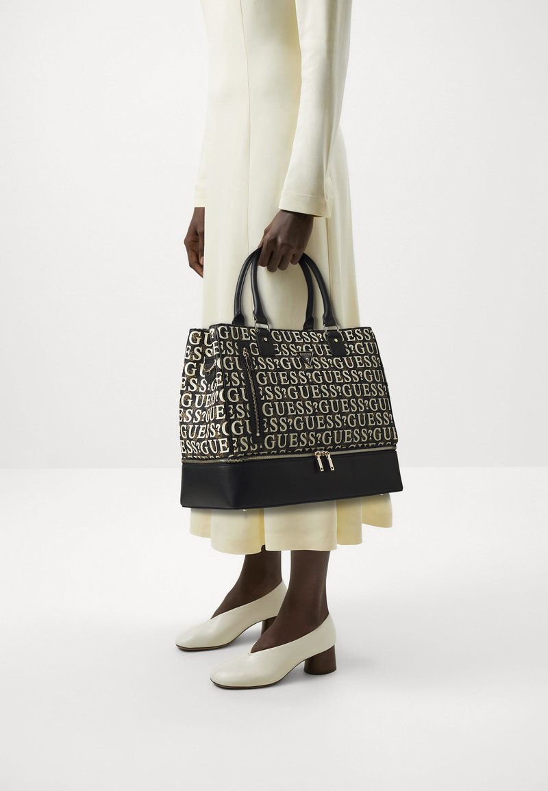 Guess STARK ZIP BOTTOM TOTE - Shopping Bag - brown multi/braun - Zalando.ch