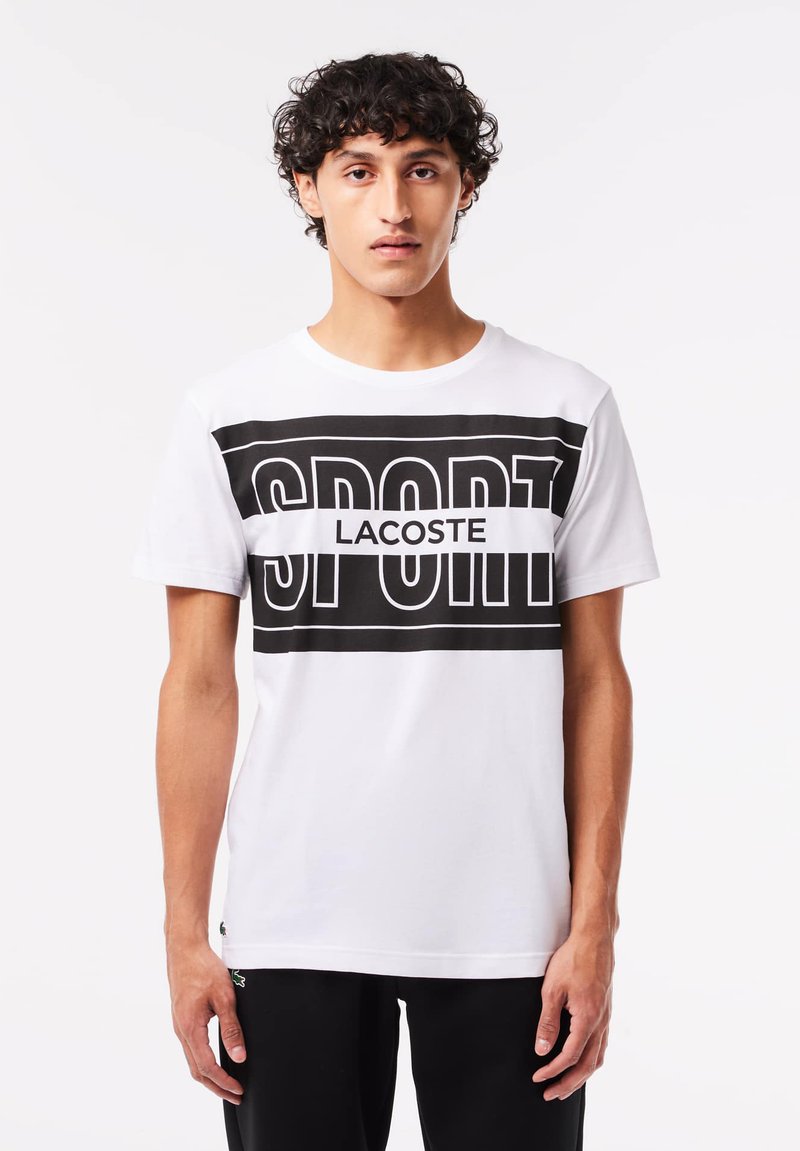Lacoste SPORTS T-SHIRT LOGO GRAPHIC - Nyomott mintás póló - white/fehér ...