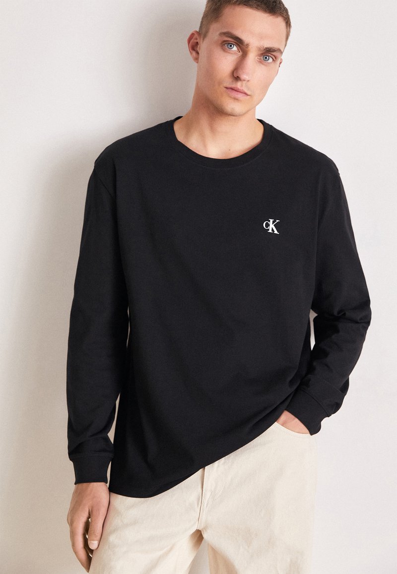 Calvin Klein Jeans MONOLOGO BACK GRAPHIC TEE UNISEX - Langarmshirt - black/bright white/schwarz ...