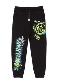 Calliope GINNICO STAMPE GRAFFITI - Tracksuit bottoms - nero ultrablack ...