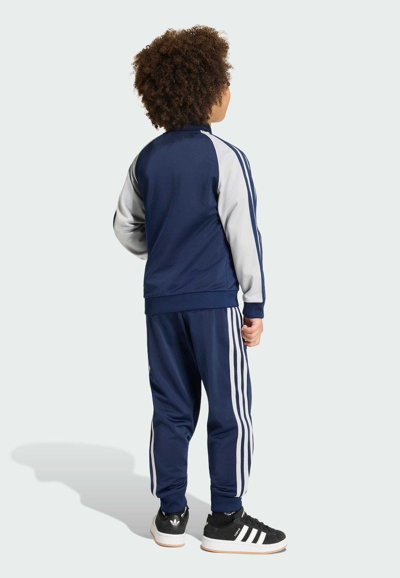 adidas Originals SST TRACKSUIT-KIDS UNISEX SET - Tracksuit - night ...