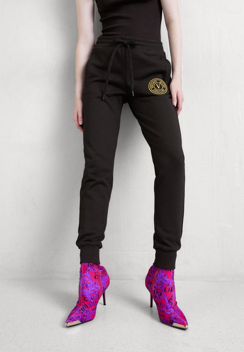 Versace Jeans Couture HEAVY DIAGONAL - Tracksuit bottoms - black/gold ...