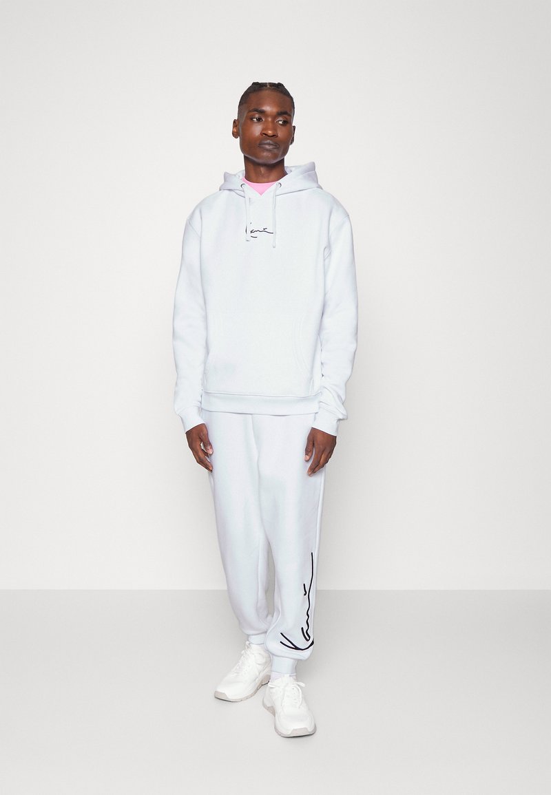 Karl Kani ESSENTIAL TRACKSUIT SET UNISEX - Tracksuit - white - Zalando.de