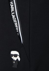 KARL LAGERFELD PANTS - Tracksuit bottoms - black/black - Zalando.ie