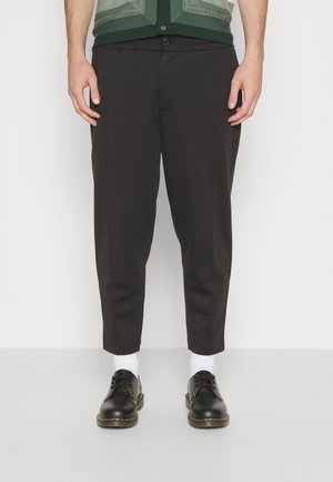 Weekday KEN TRACKPANTS UNISEX - Pantalones - black/negro - Zalando.es