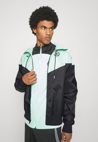 Nike Performance CHELSEA LONDON WINDRUNNER HOODED JACKET - Fanartikel - mint foam/black ...