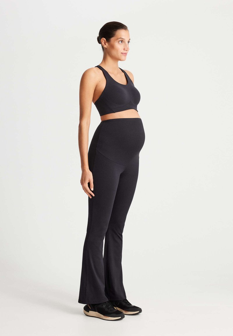 OYSHO COMFORT FLARE - Pantaloni - black/nero - Zalando.it