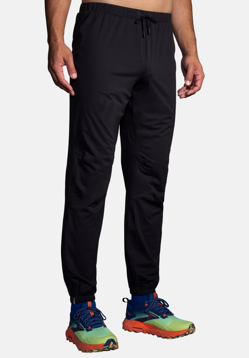 Brooks HIGH POINT WATERPROOF PANT - Tracksuit bottoms - black - Zalando.ie