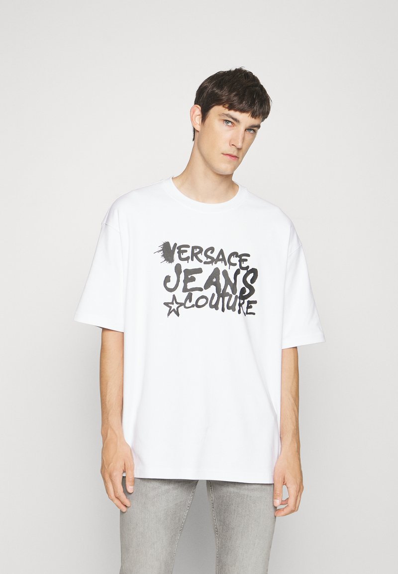 Versace Jeans Couture LOGO DRIPPING - T-shirt print - white/wit ...