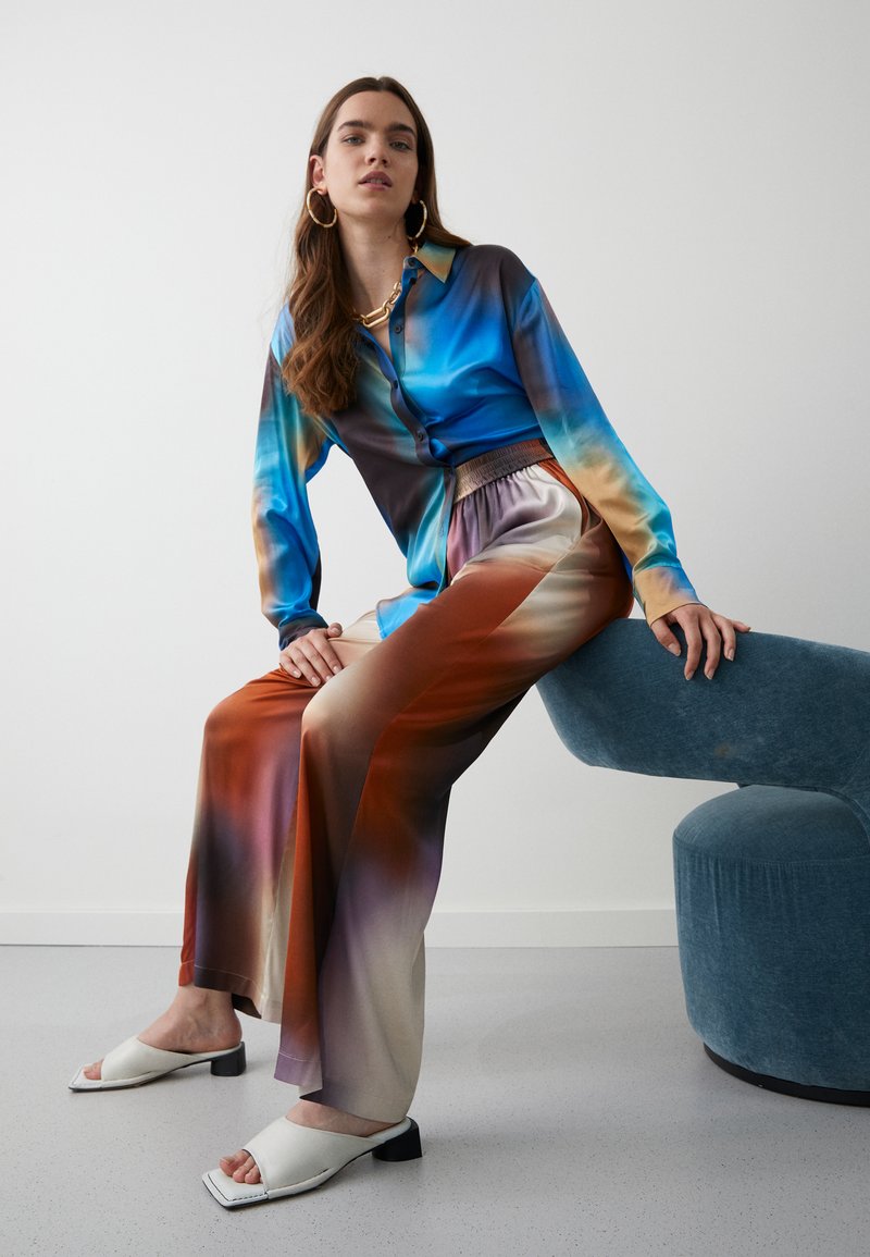 MUNTHE ACTIVE - Trousers - rust/rose gold-coloured - Zalando.de