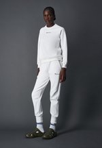 Champion TECH AMERICAN TECH - Trainingsbroek - offwhite/crème - Zalando.nl