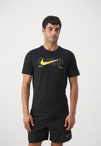 Nike Performance TEE RUN - Sports T-shirt - black - Zalando.co.uk