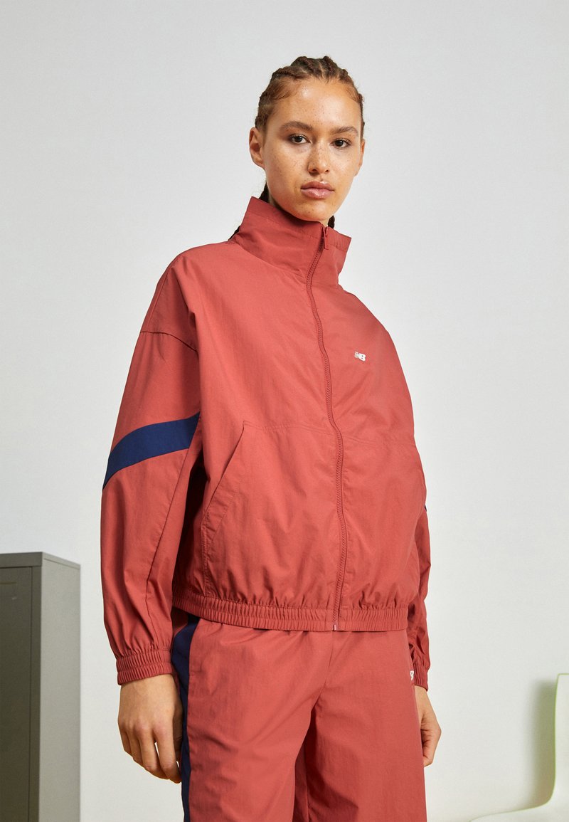 New Balance ATHLETICS JACKET - Summer jacket - astro dust/dark red ...