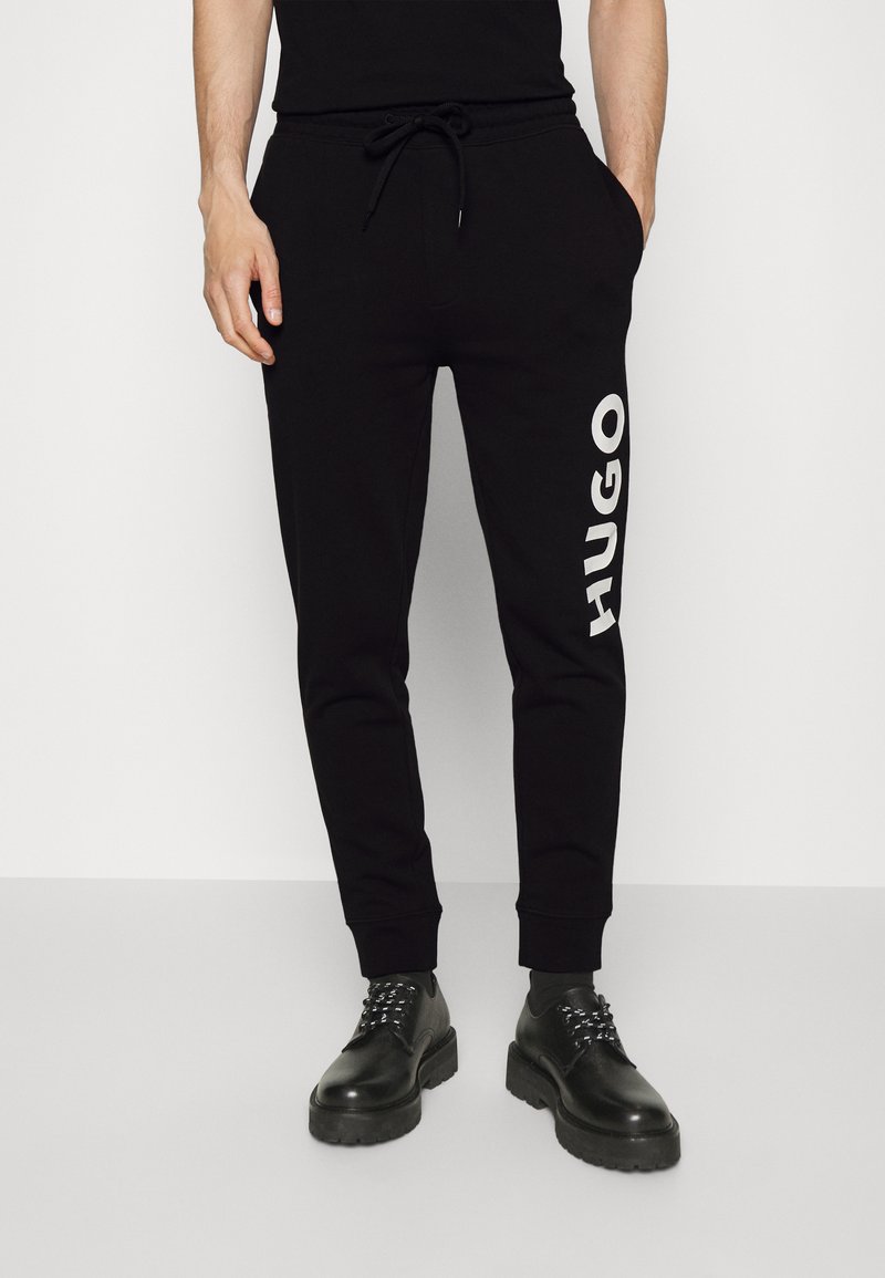 HUGO DUTSCHI - Jogginghose - black/schwarz - Zalando.de