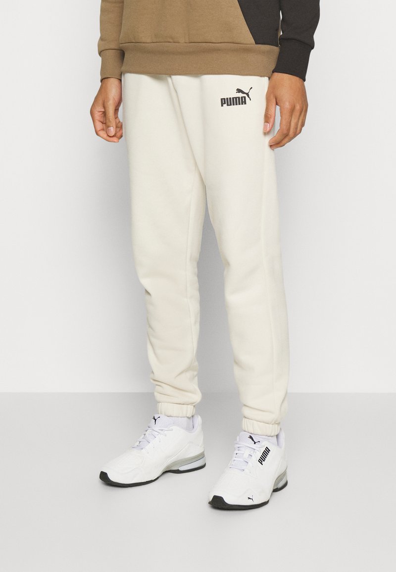 Puma ELEVATED - Tracksuit bottoms - alpine snow/white - Zalando